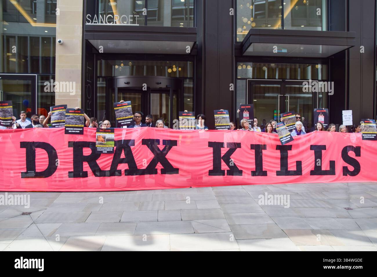 London, England, UK. 1st May, 2025. Protesters hold a 'Drax kills ...