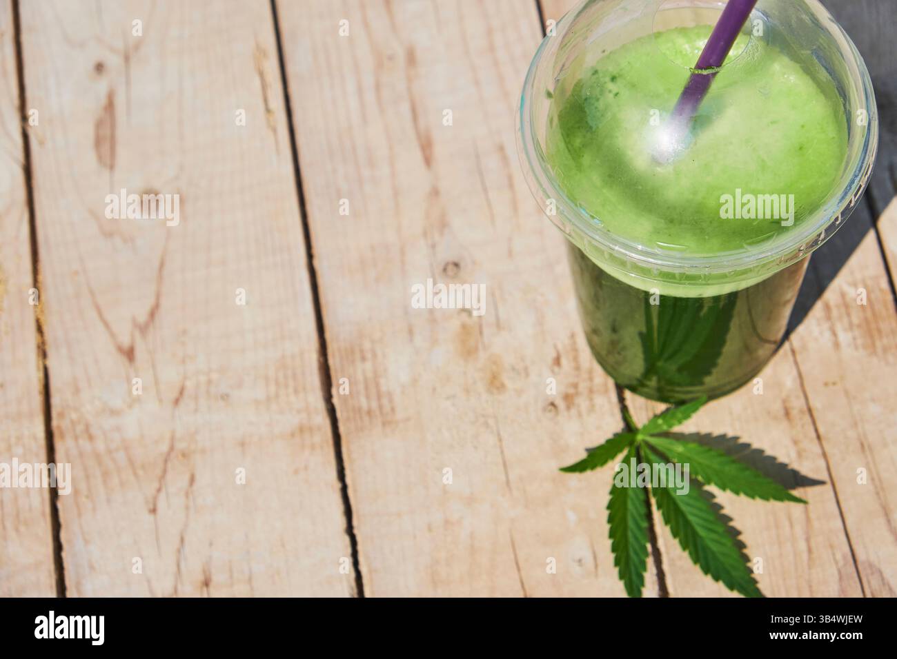 Green marijuana smoothie juice on white background Stock Photo - Alamy