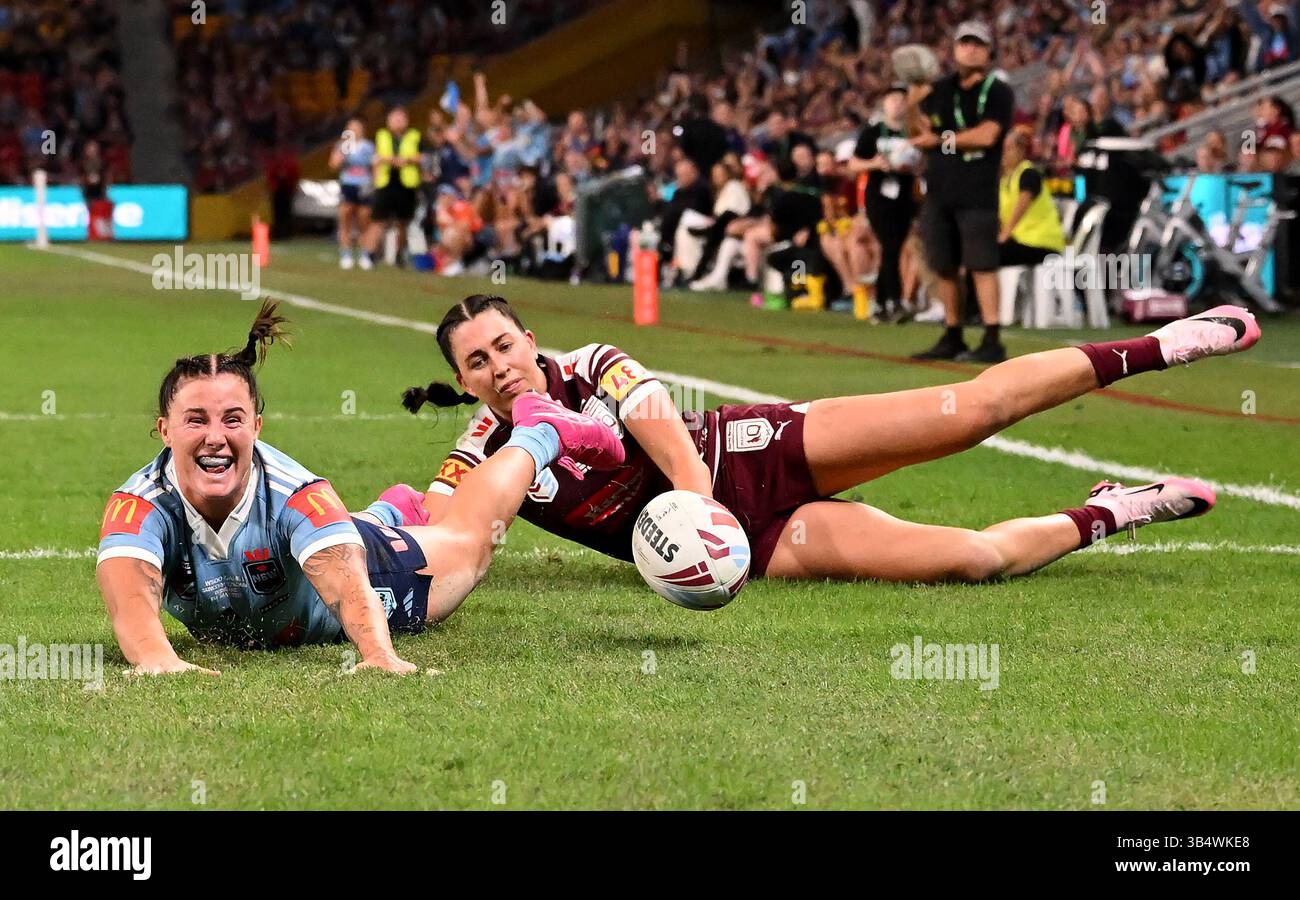 Jayme Fressard of the Blues scores a try during the Rugby league Women ...