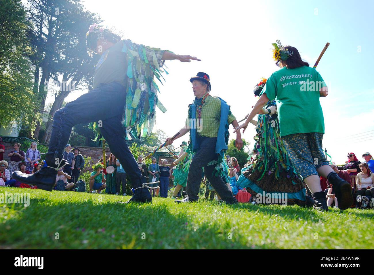 People during the Beltane celebrations at Glastonbury Chalice Well ...