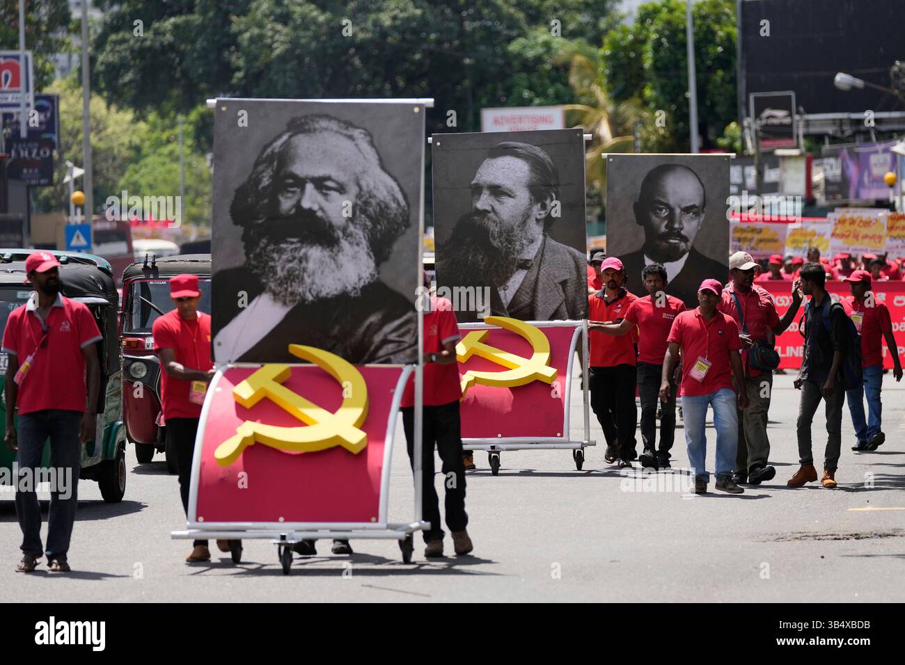 Members of the Frontline Socialist Party parade carrying portraits of ...