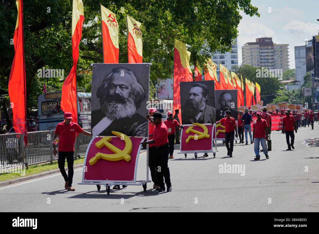 Members of the Frontline Socialist Party parade carrying portraits of ...