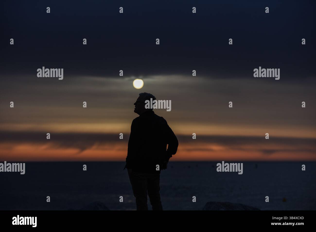 Barcelona, Spain. 01st May, 2025. A man seen during sunrise behind a ...