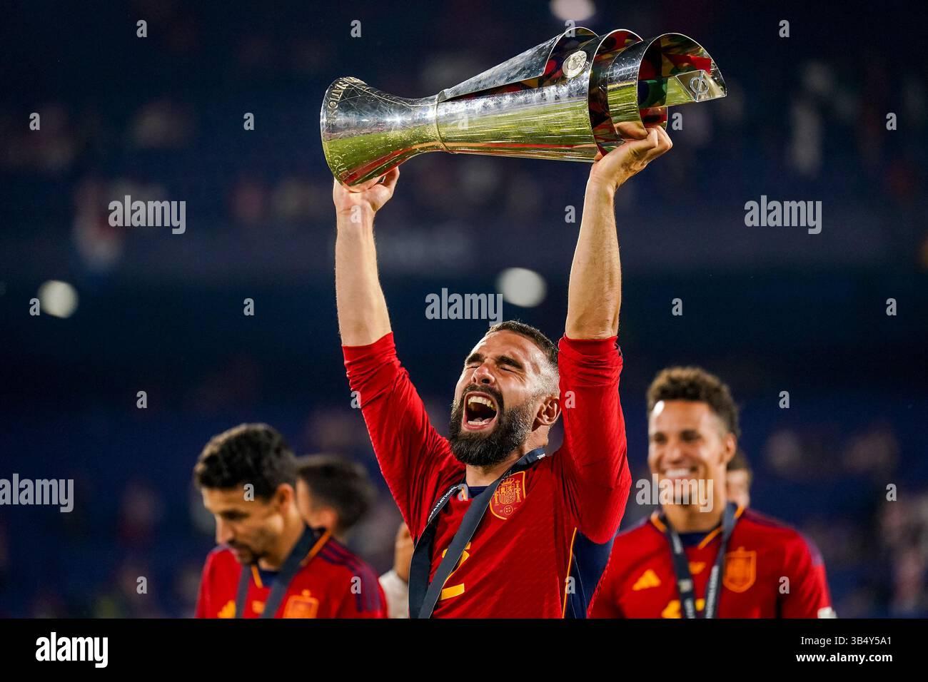 ROTTERDAM, NETHERLANDS - JUNE 18: Dani Carvajal of Spain lifts up the ...