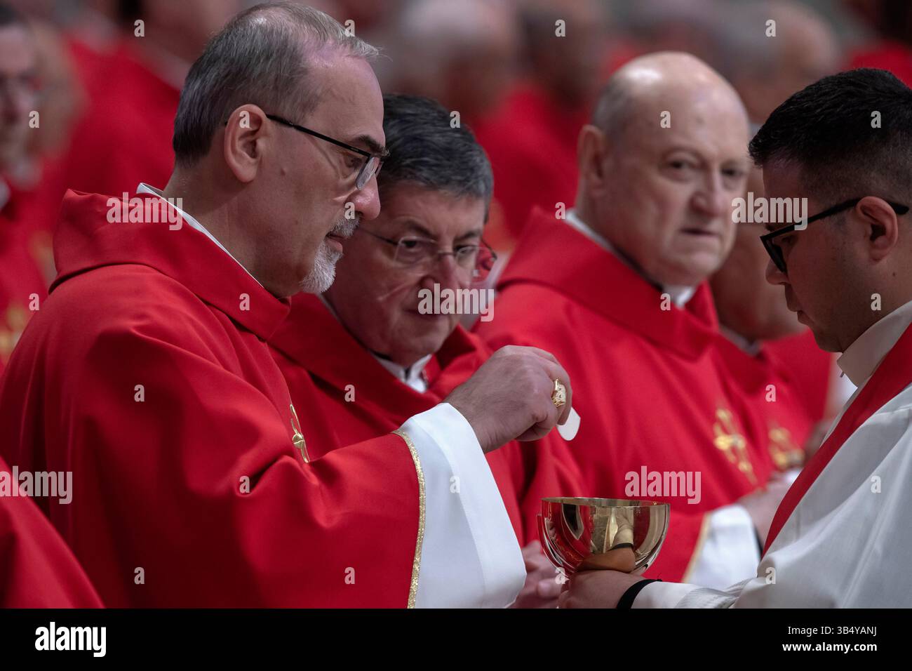 Cardinal Pierbattista Pizzaballa receives communion during a mass on ...