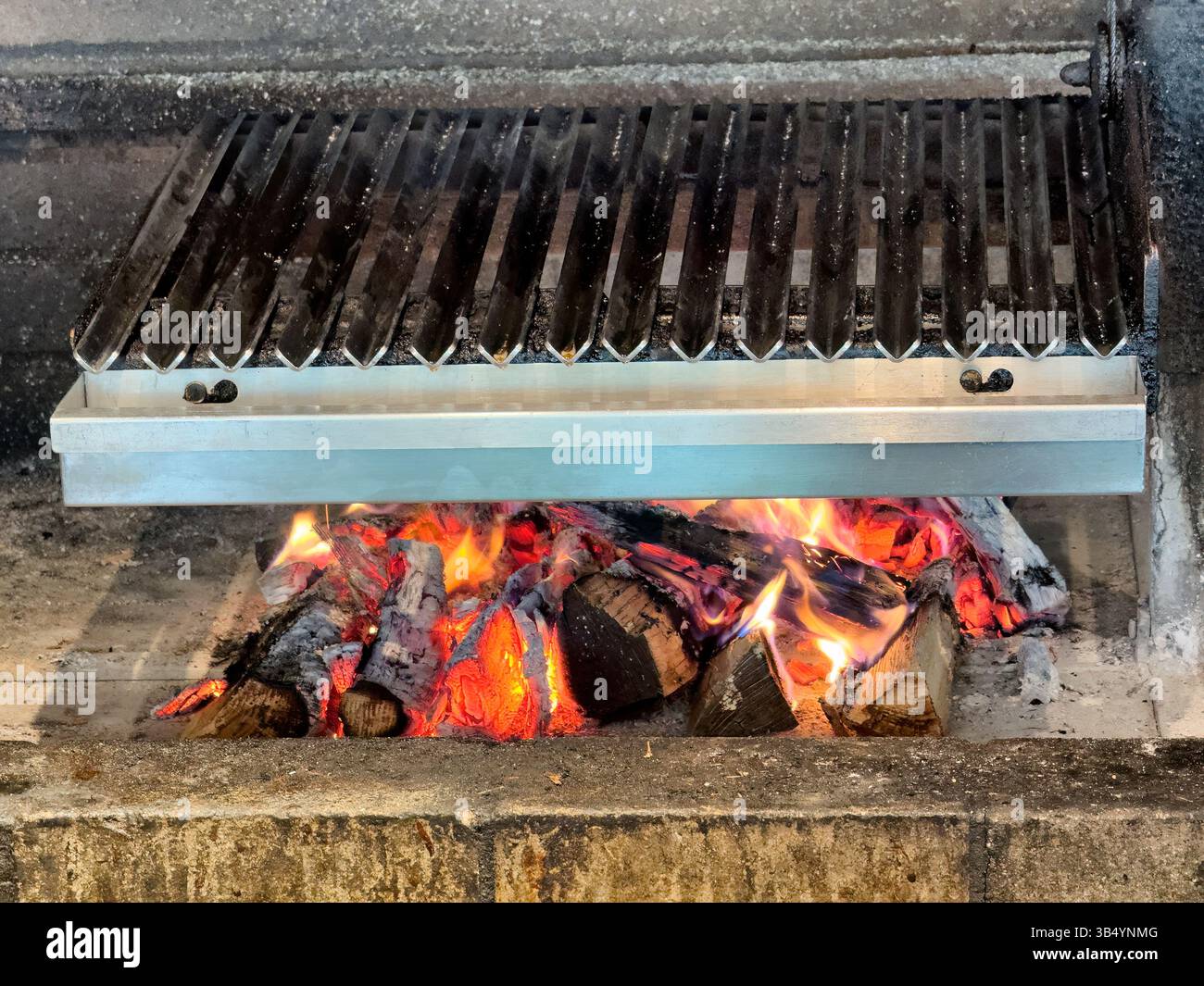 Real wood stove with glowing fire and hot ash coal ready to cook Stock ...