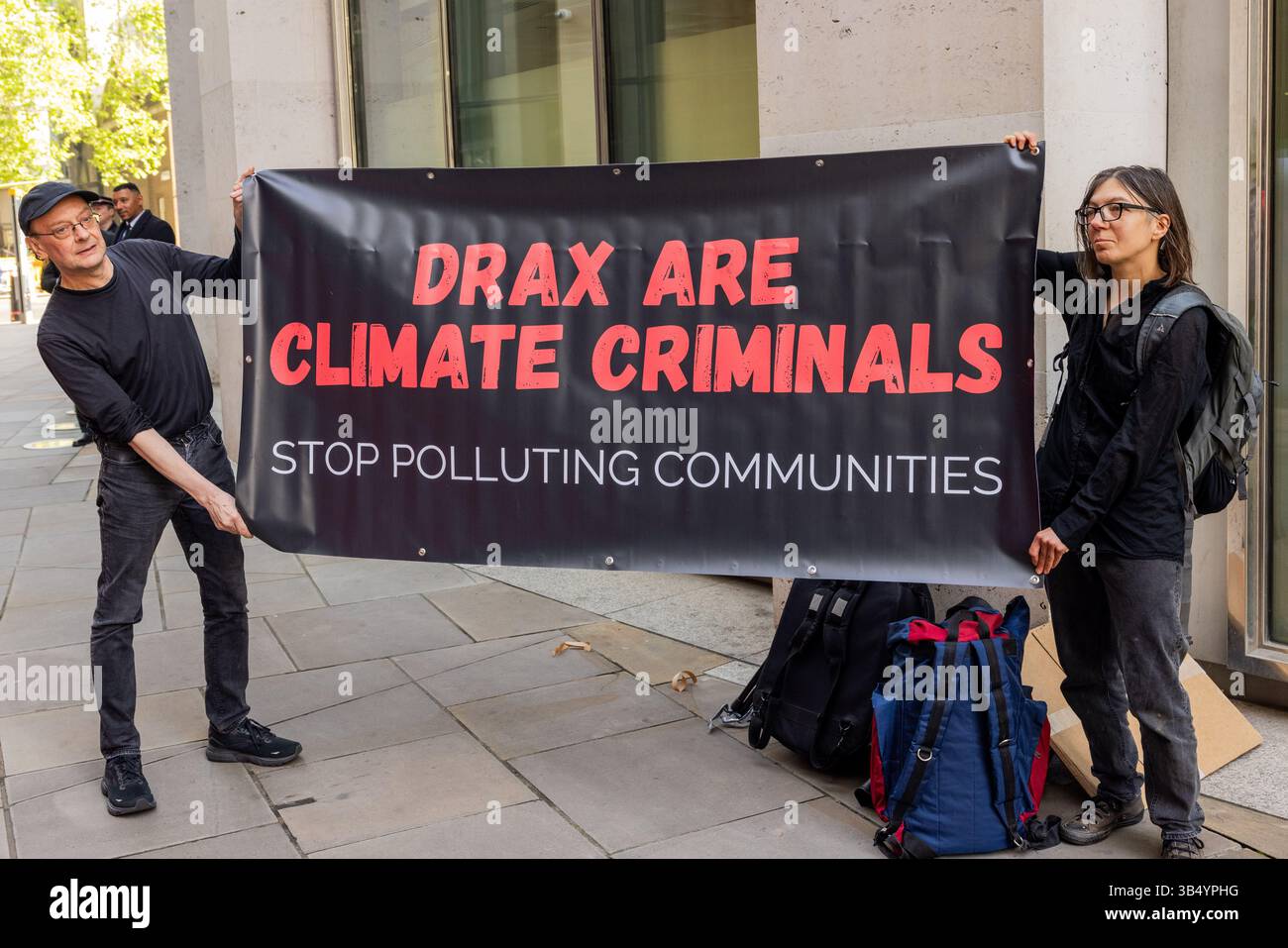 London, UK. 01 MAY, 2025. "Drax are climate criminals" banner is held ...
