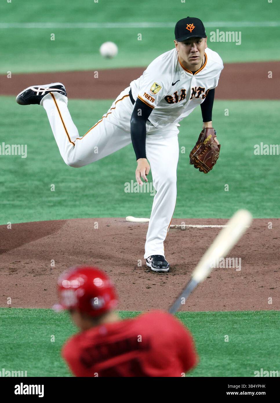 Yomiuri Giants starting pitcher Masahiro TANAKA reacts to a single by ...