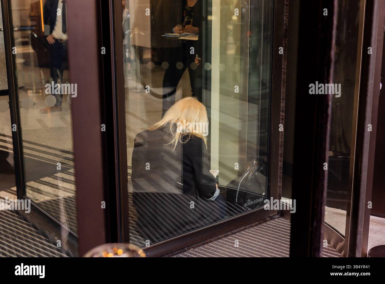 London, UK. 01 MAY, 2025. A protestor blocks the revolving door as AXE ...