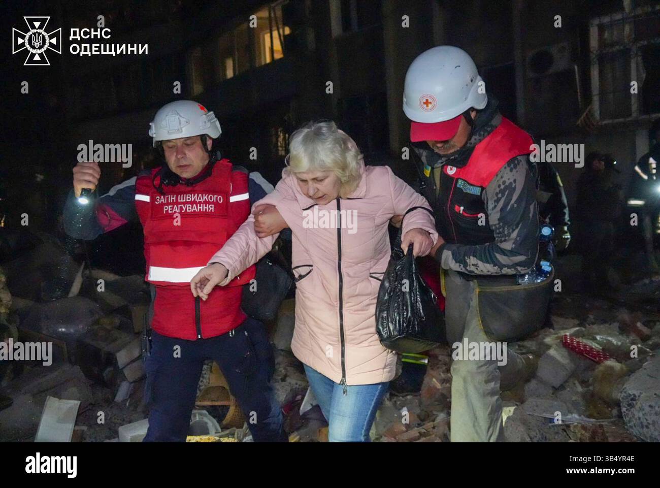 In this photo provided by the Ukrainian Emergency Service, rescuers ...