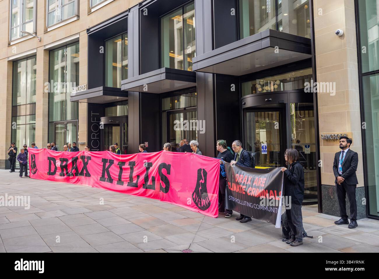 London, UK. 01 MAY, 2025. "Drax kills" banner is held outside as AXE ...