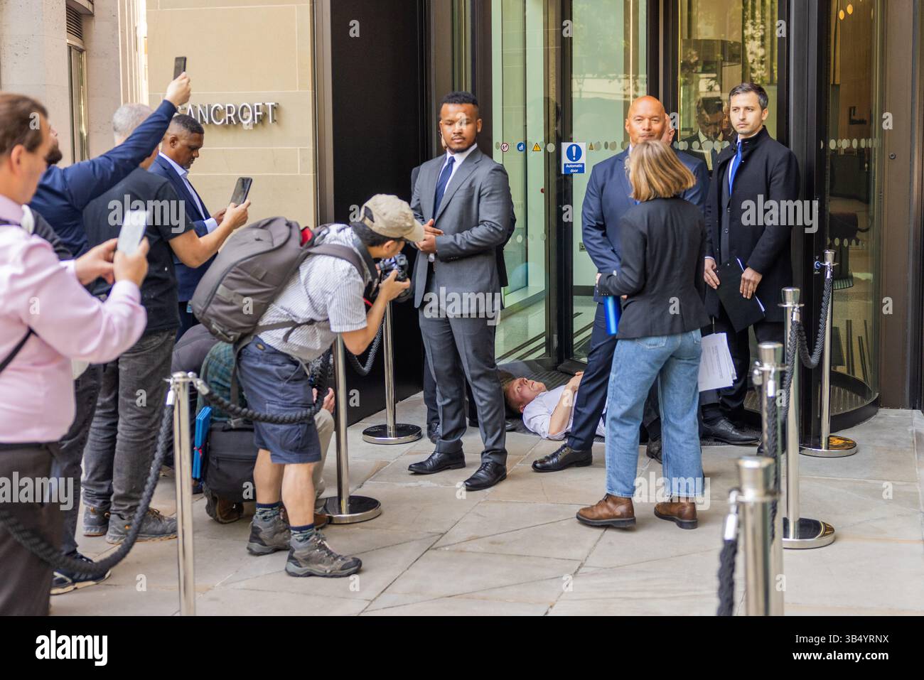 London, UK. 01 MAY, 2025. Protestor plays dead on floor as AXE DRAX ...