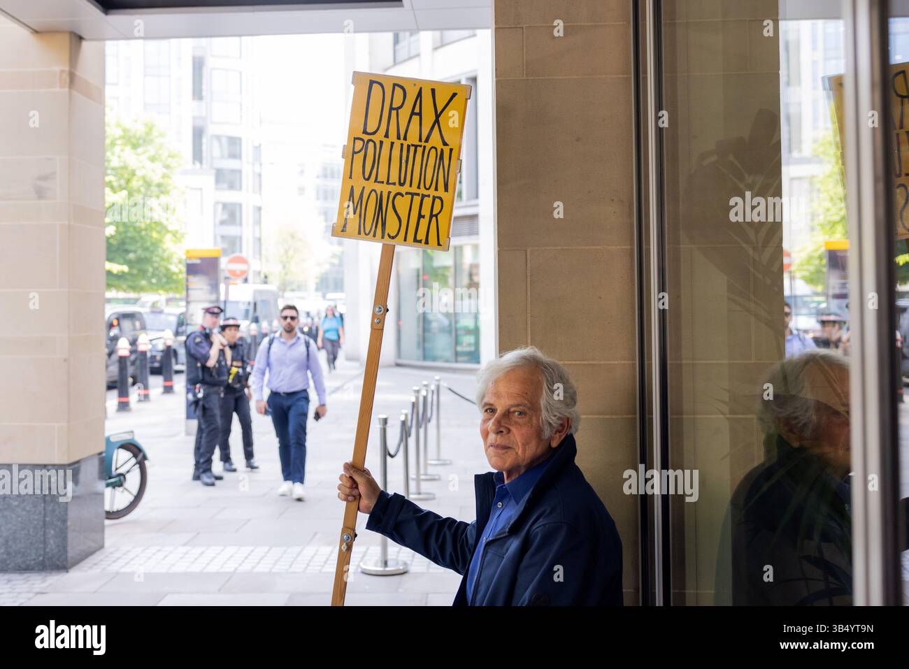 London, UK. 01 MAY, 2025. Man holds "Drax Pollution monster" sign ...