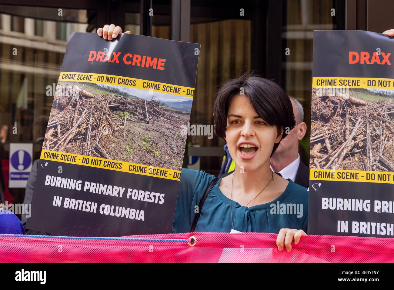London, UK. 01 MAY, 2025. Protestor holds "drax crime" sign following ...