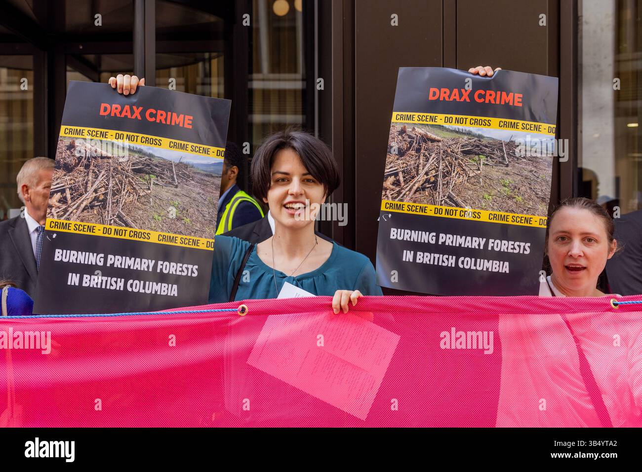 London, UK. 01 MAY, 2025. Protestors hold "drax crime" sign following ...