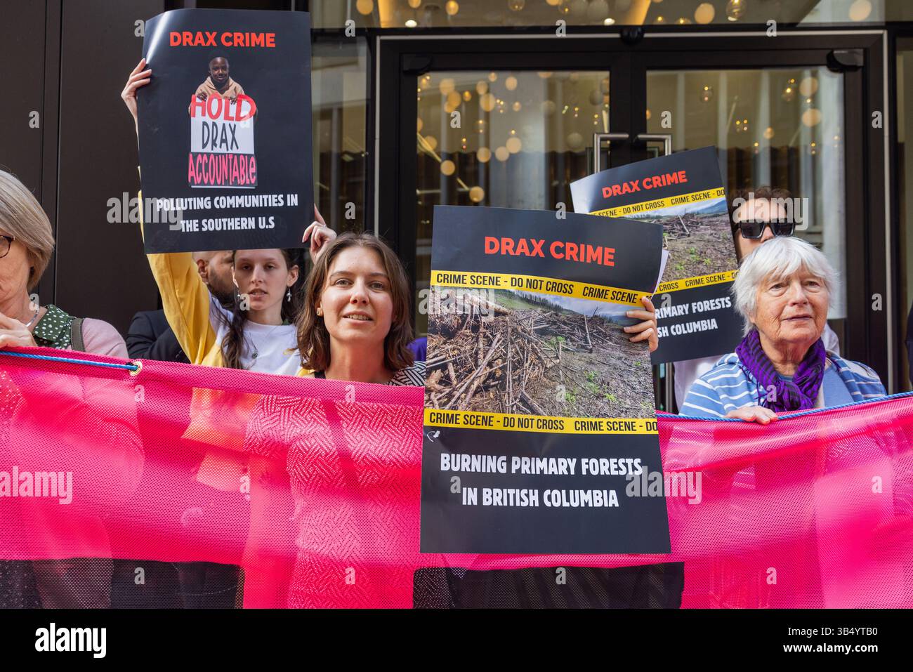 London, UK. 01 MAY, 2025. Protestors hold "drax crime" sign following ...