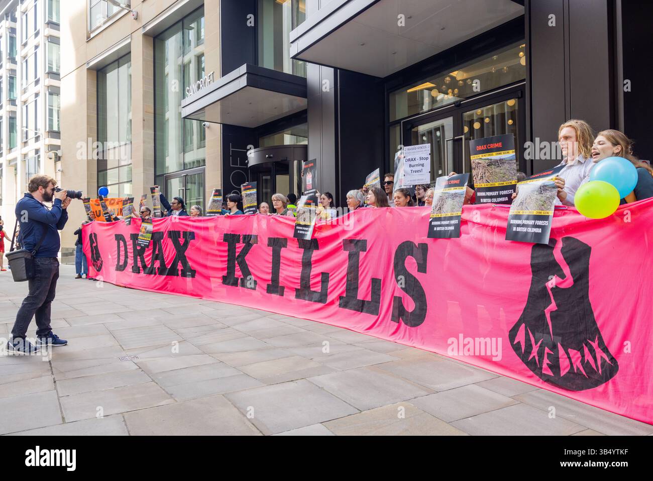 London, UK. 01 MAY, 2025. Protestors hold "drax crime" sign following ...