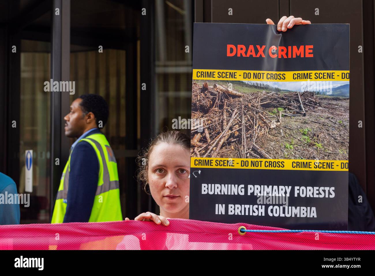 London, UK. 01 MAY, 2025. Protestor holds "drax crime" sign following ...