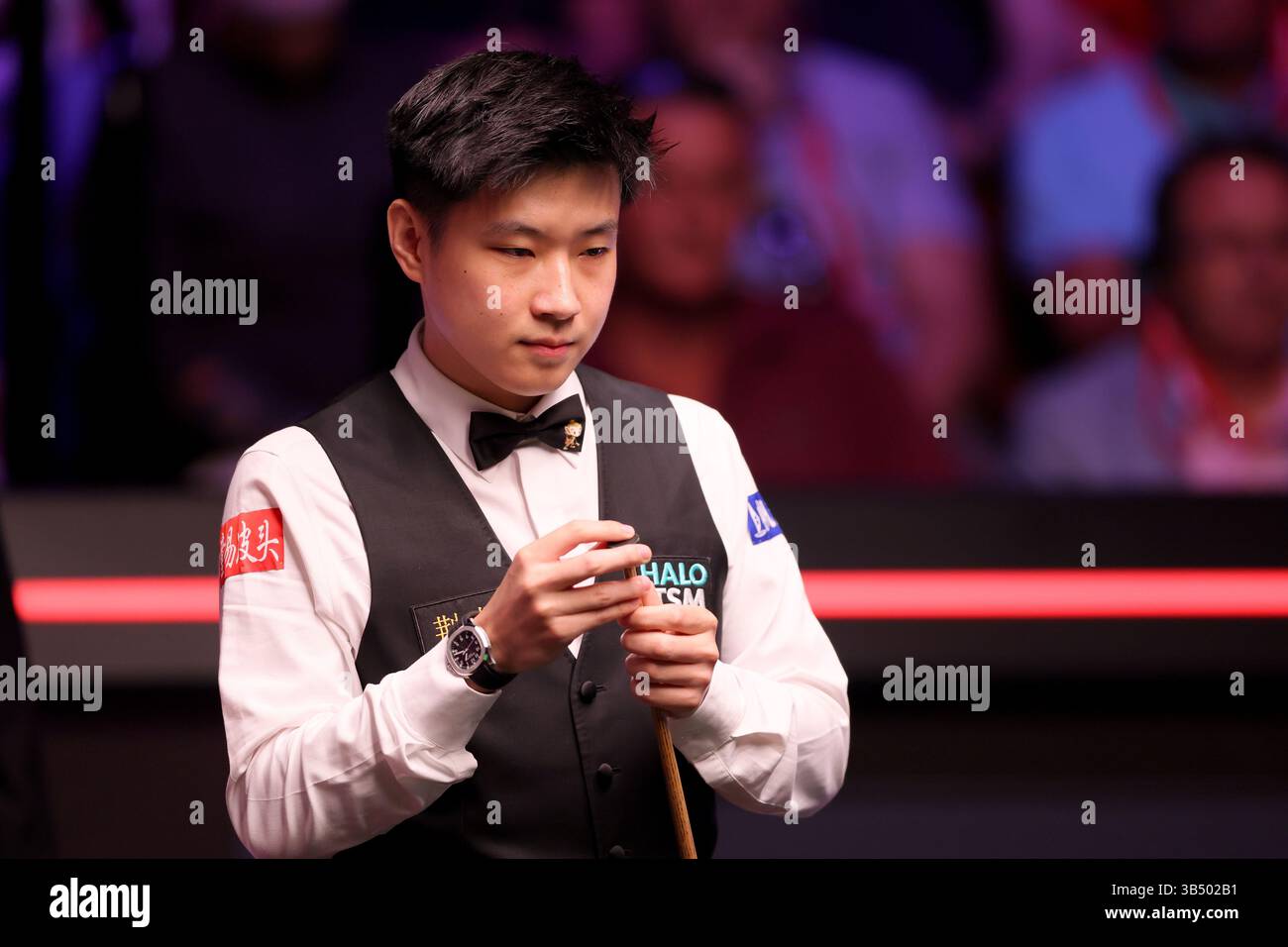 Zhao Xintong during his match against Ronnie O'Sullivan (not pictured) on day thirteen of the ...