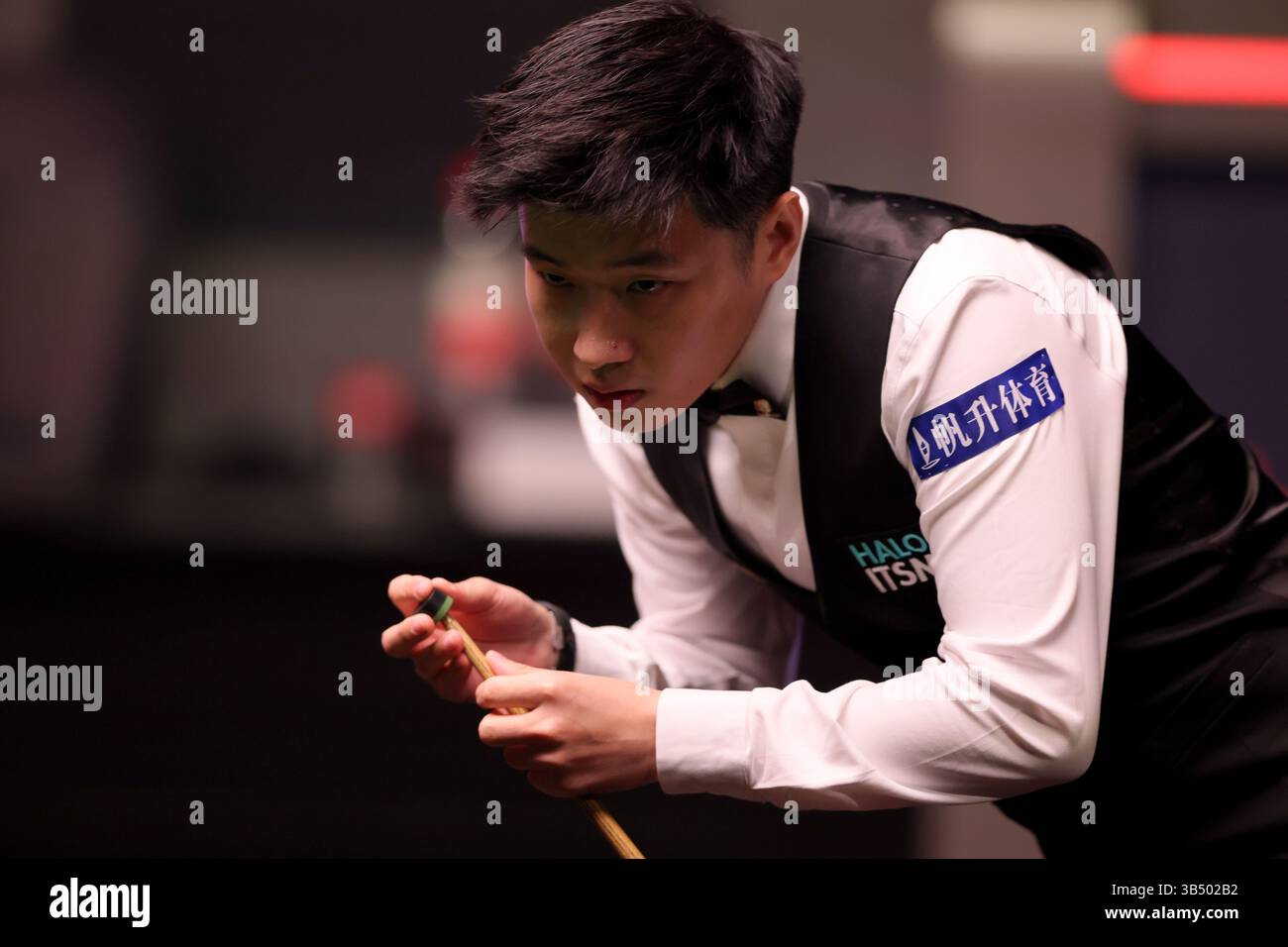 Zhao Xintong during his match against Ronnie O'Sullivan (not pictured) on day thirteen of the ...