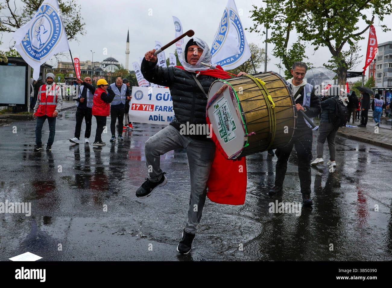 People take part in a Labor Day celebration rally in Istanbul, Turkey ...