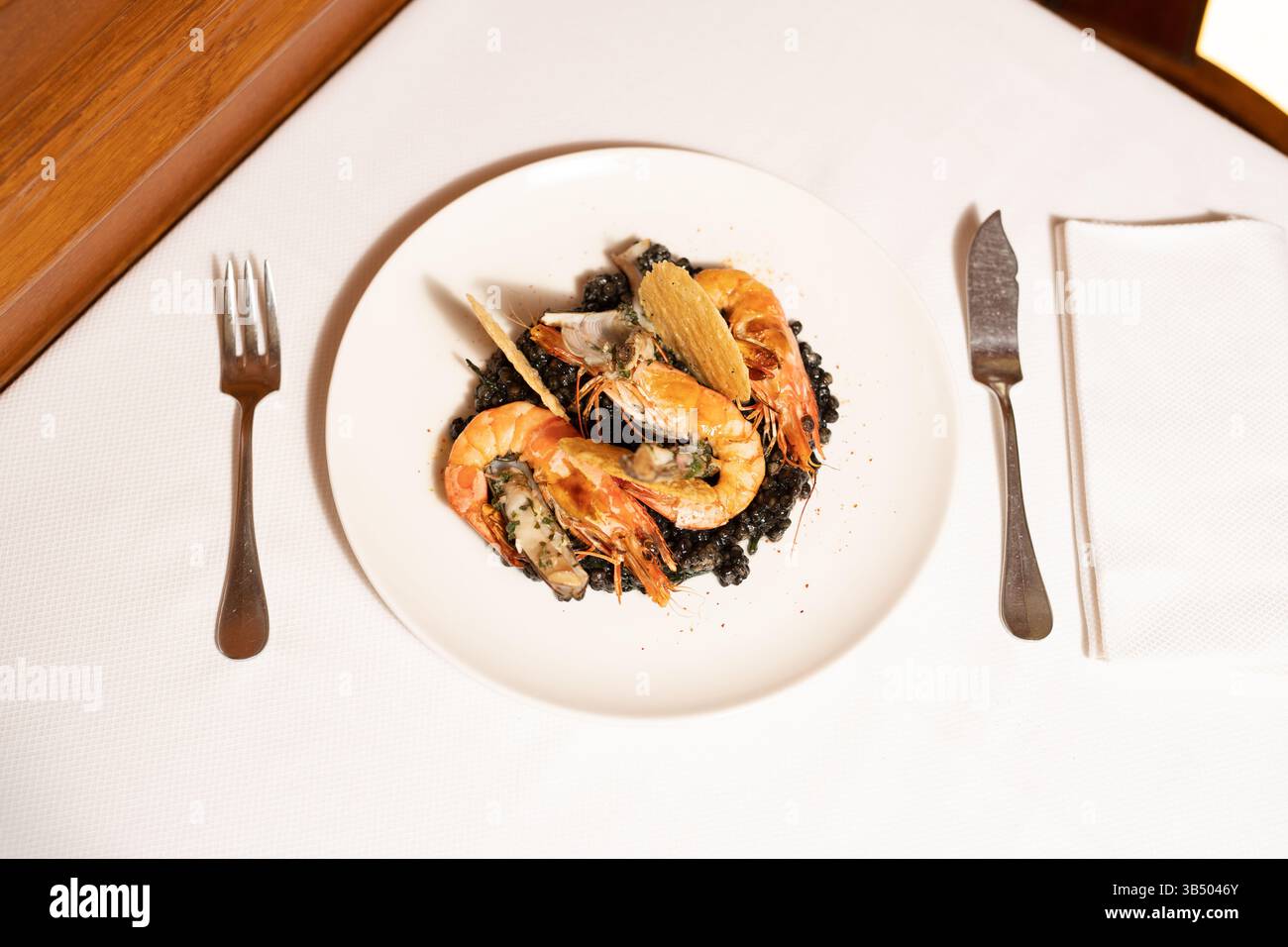 Elegant Shrimp & Black Rice Dish – Gourmet Seafood Plating in Upscale ...