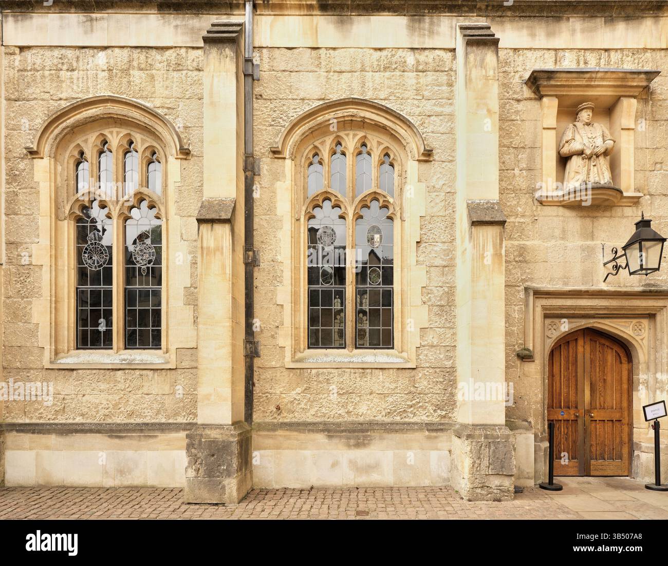 Statue of founder, Thomas Pope, above the entrance to the Dining Hall ...
