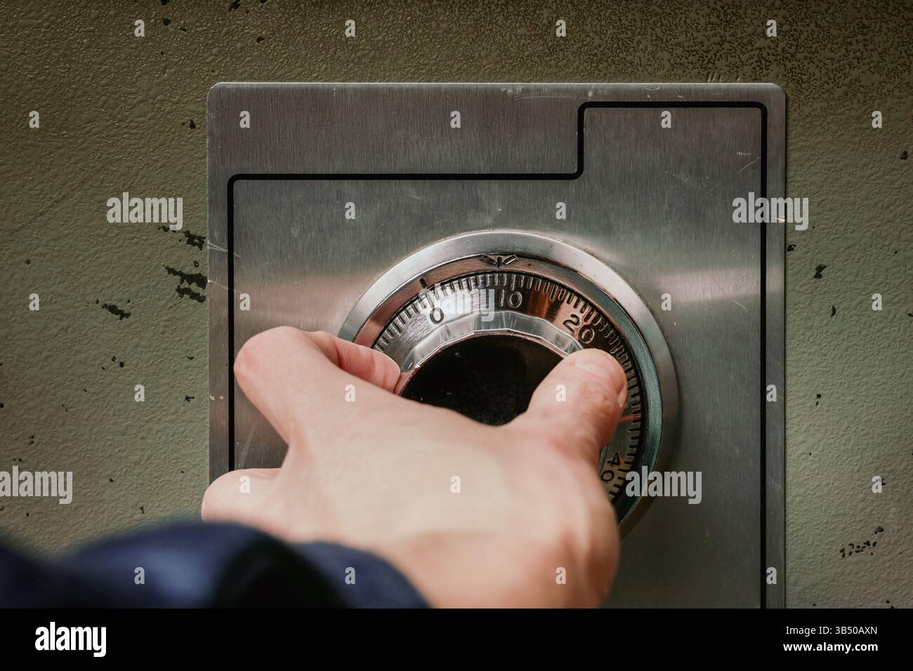 Person using security safe with mechanical combination lock or dial ...