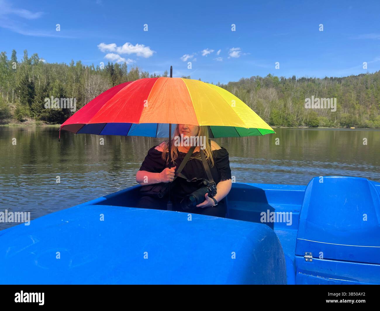 01 May 2025, Saxony-Anhalt, Wendefurth: A visitor protects herself from ...