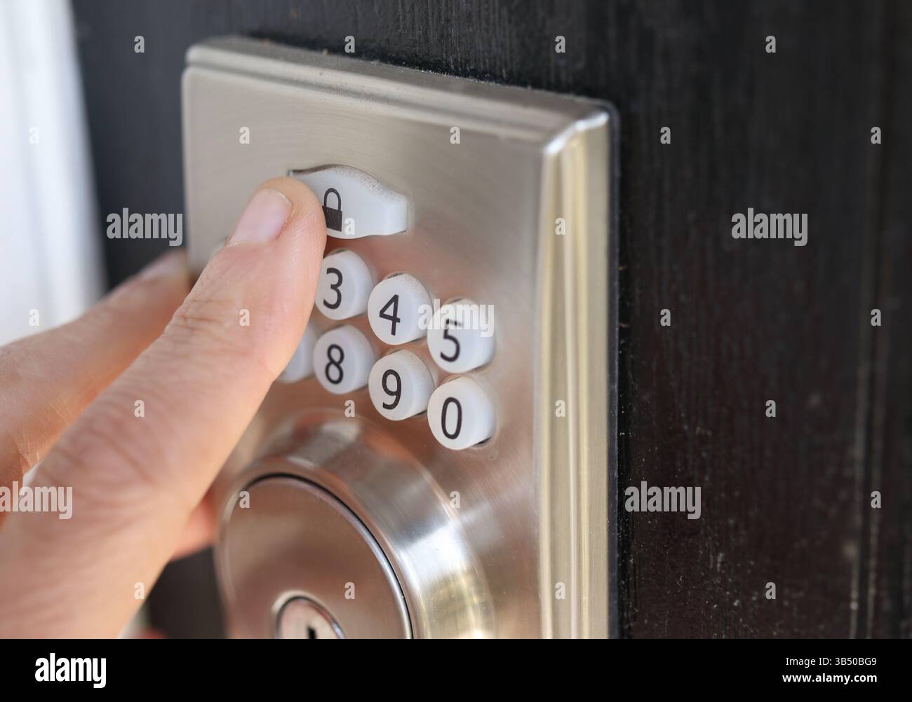 Person using electric door keypad, close up. Finger on keyless door ...