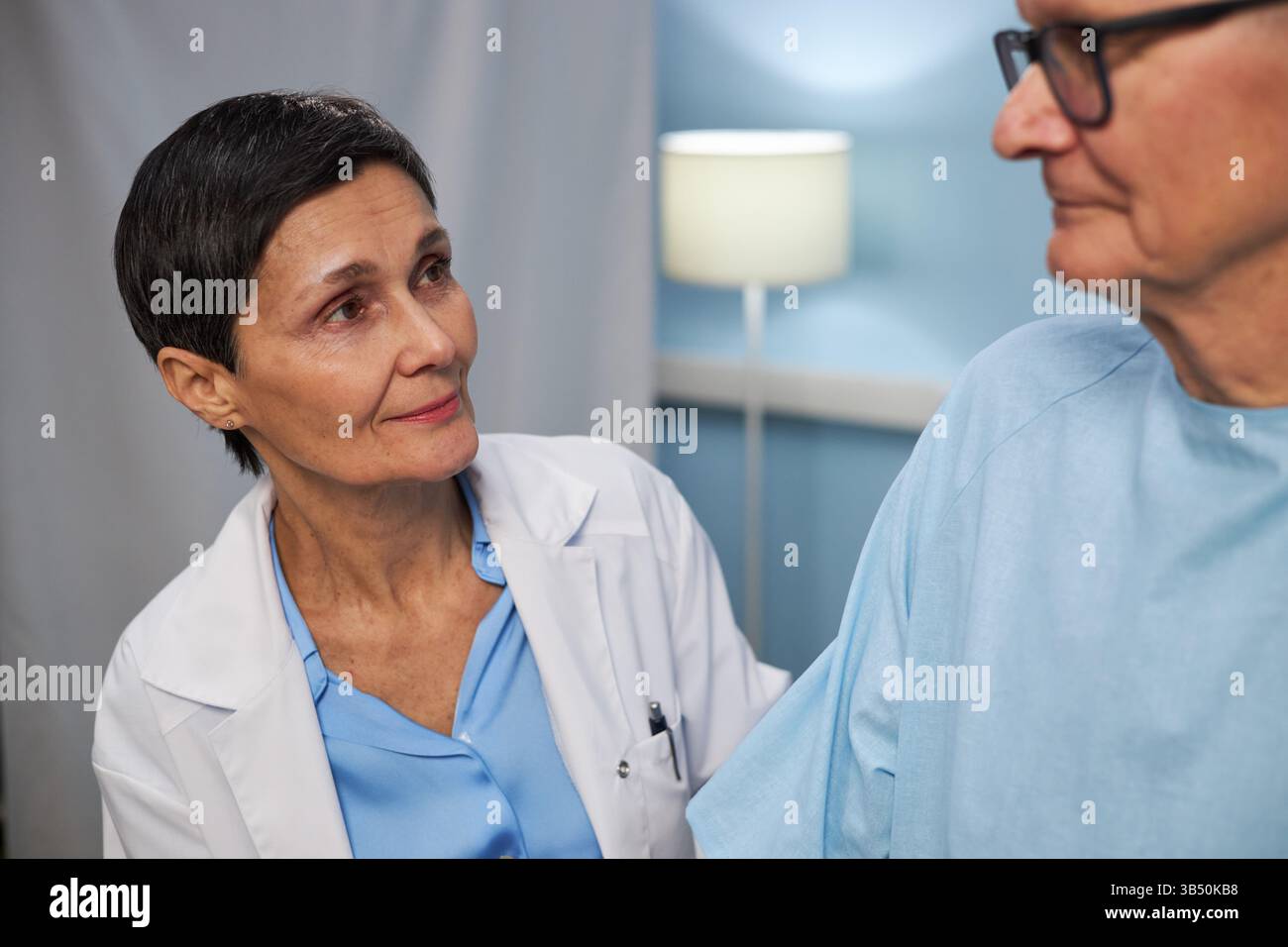 Medical professional engaging senior hi-res stock photography and ...