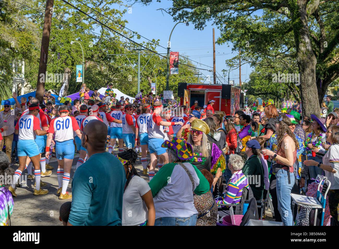 New Orleans, LA, USA - February 4, 2024: Colorfully dressed crowd lines ...
