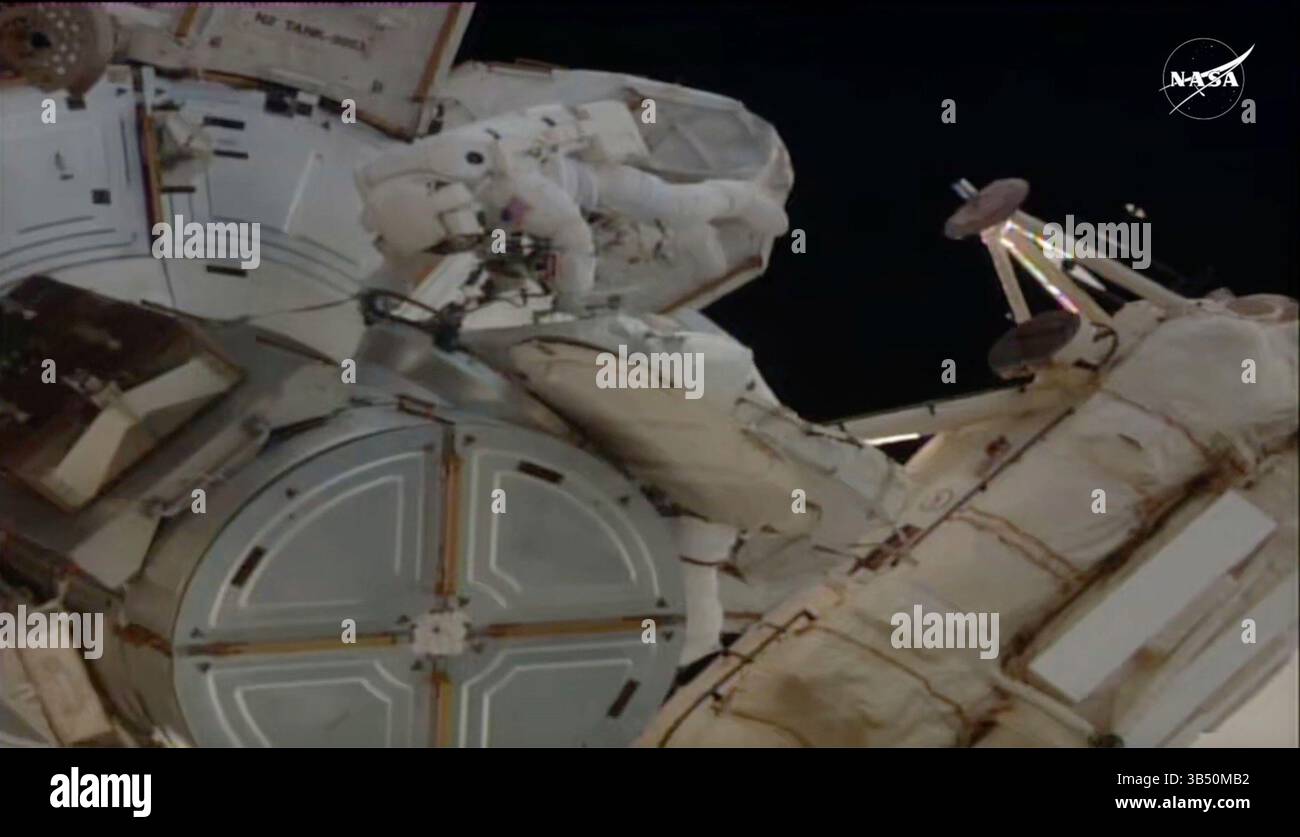 In this image provided by NASA, astronauts Anne McClain and Nichole ...