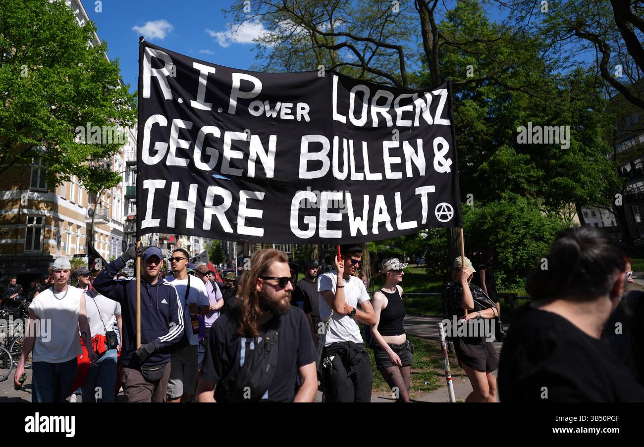 01 May 2025, Hamburg: Participants during the Black-Red May Day ...