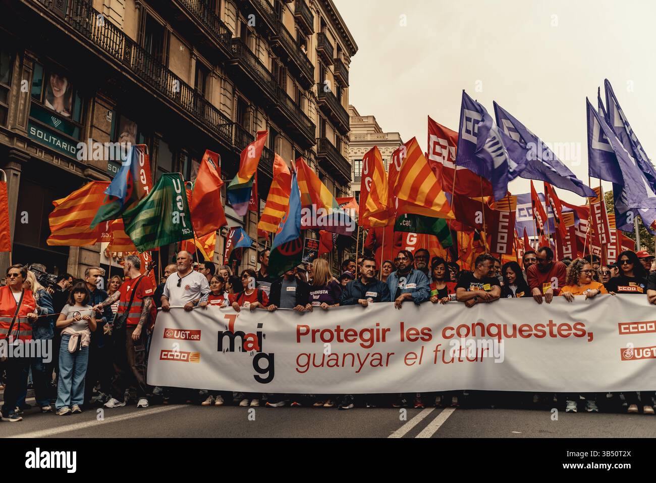 Barcelona, Spain. 1st May, 2025. Protesters holding flags march at a ...