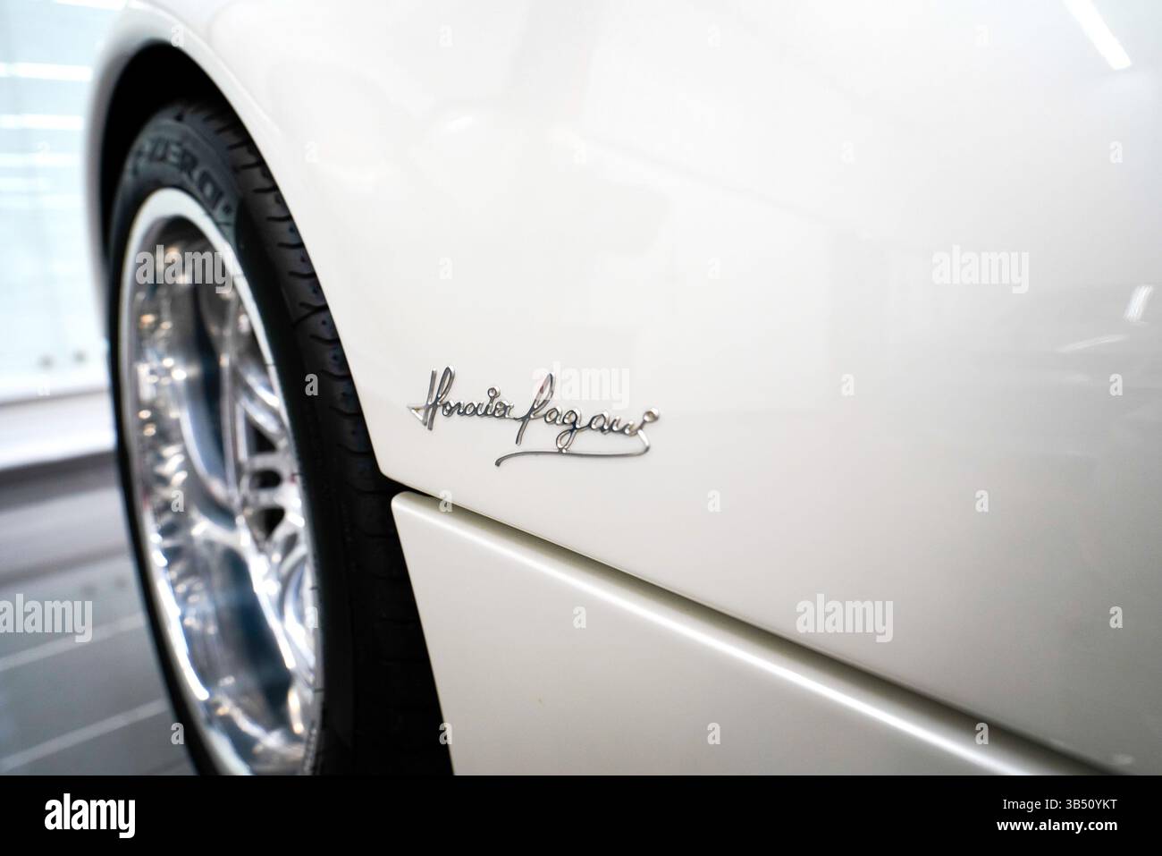 Pagani Huayra signature logo on white Stock Photo - Alamy