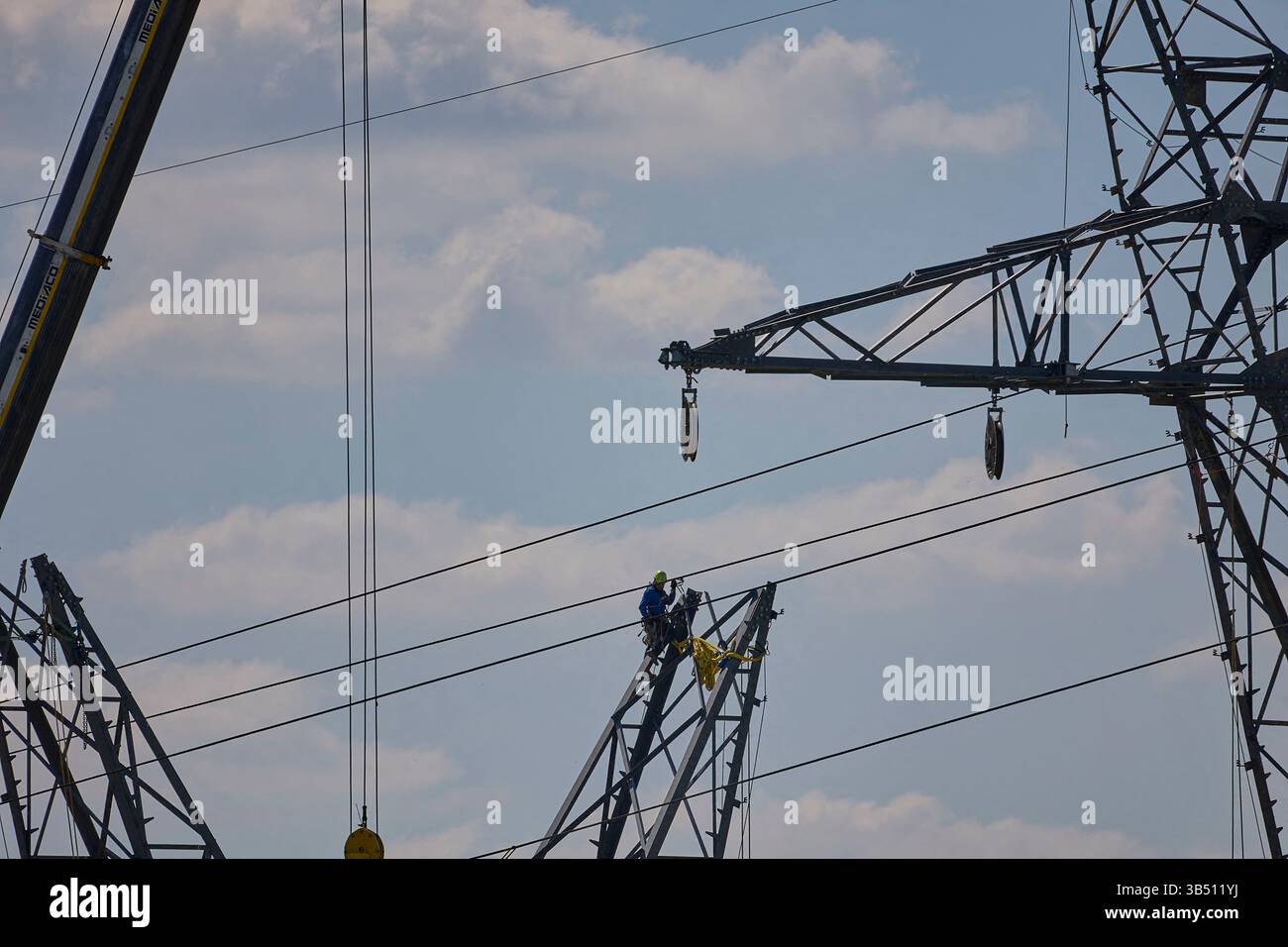 Construction & installation of a high-voltage line to supply power to ...