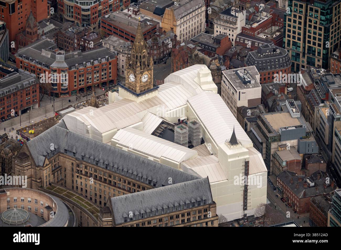 Aerial photograph of Manchester Town Hall with the clock tower emerging ...
