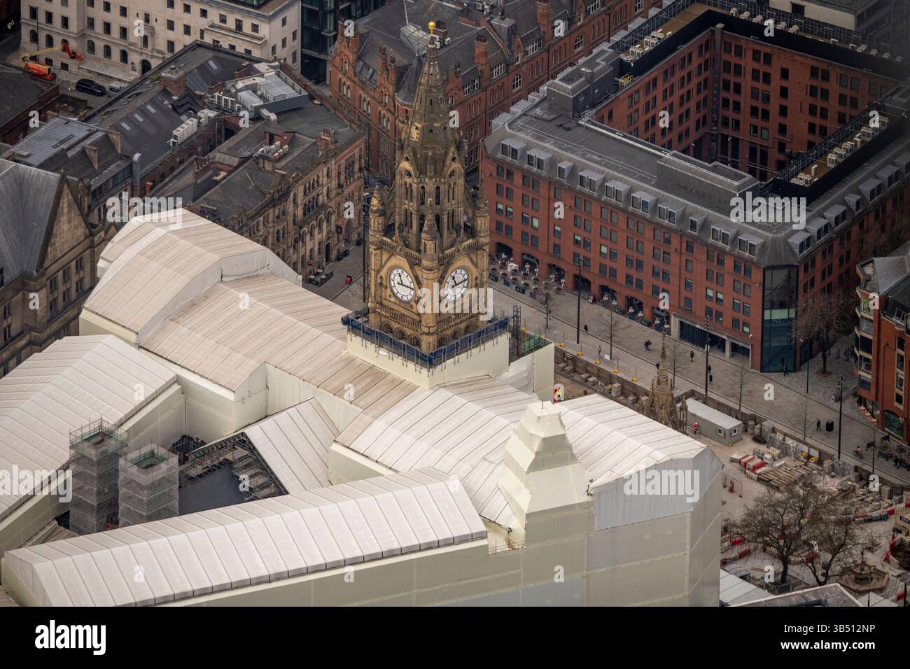 Aerial photograph of Manchester Town Hall with the clock tower emerging ...