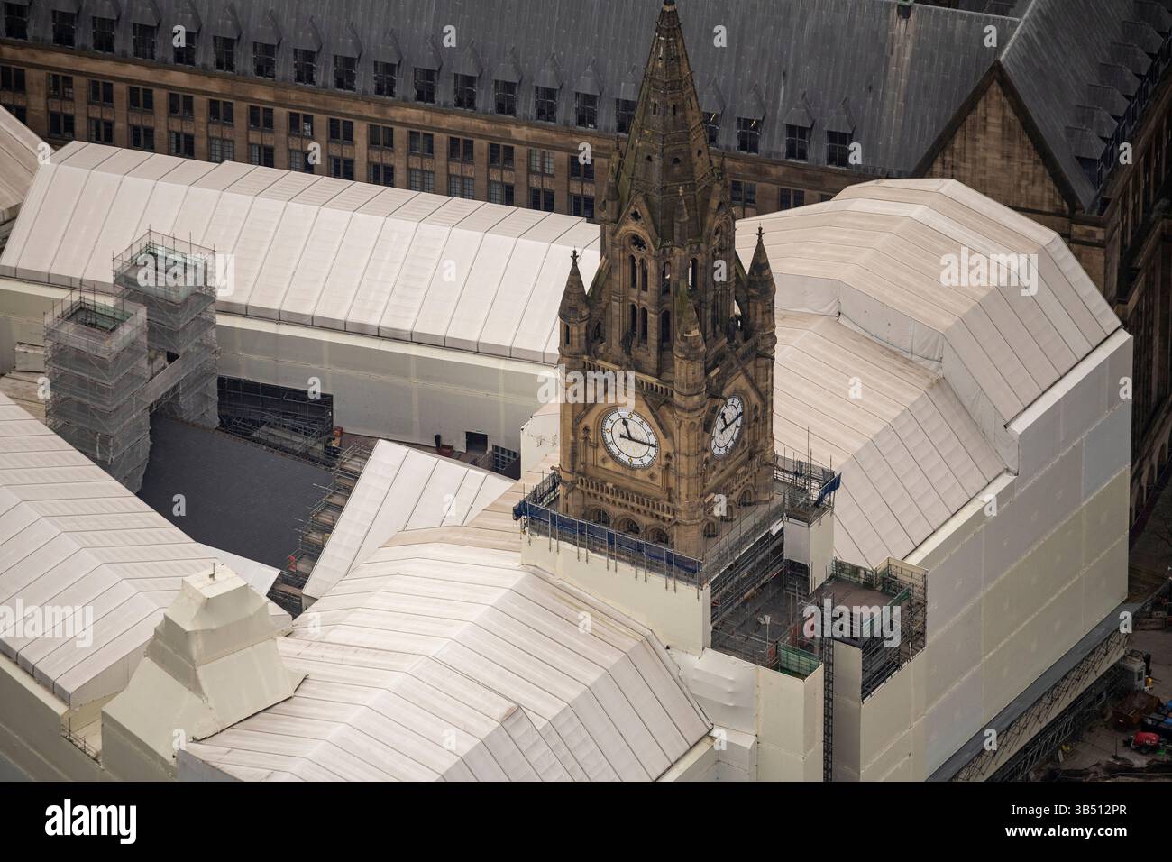 Aerial photograph of Manchester Town Hall with the clock tower emerging ...