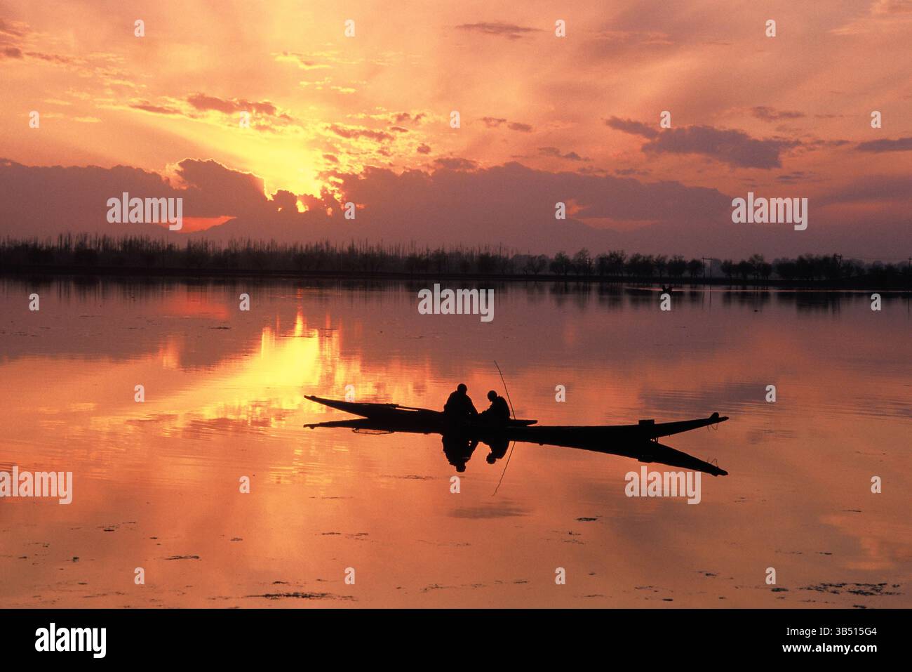 India. Jammu and Kashmir. Dal Lake at sunset with boat silhouette Stock Photo - Alamy
