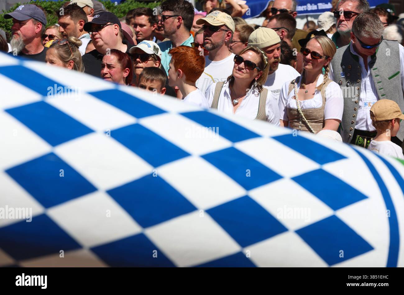 Taufkirchen, Germany. 01st May, 2025. Visitors to the maypole festival ...