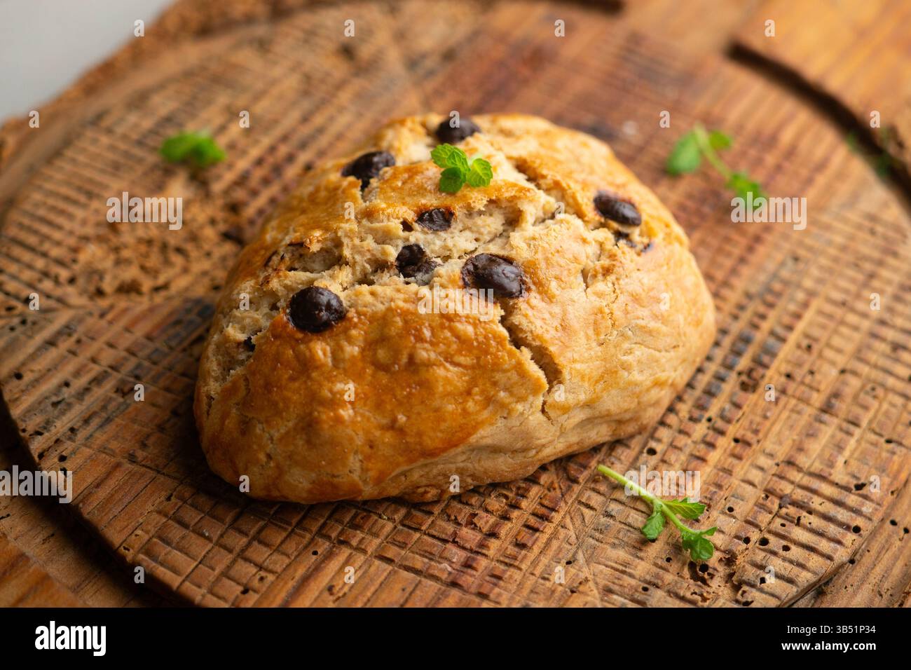 Triangular English scones with dark chocolate chips Stock Photo - Alamy