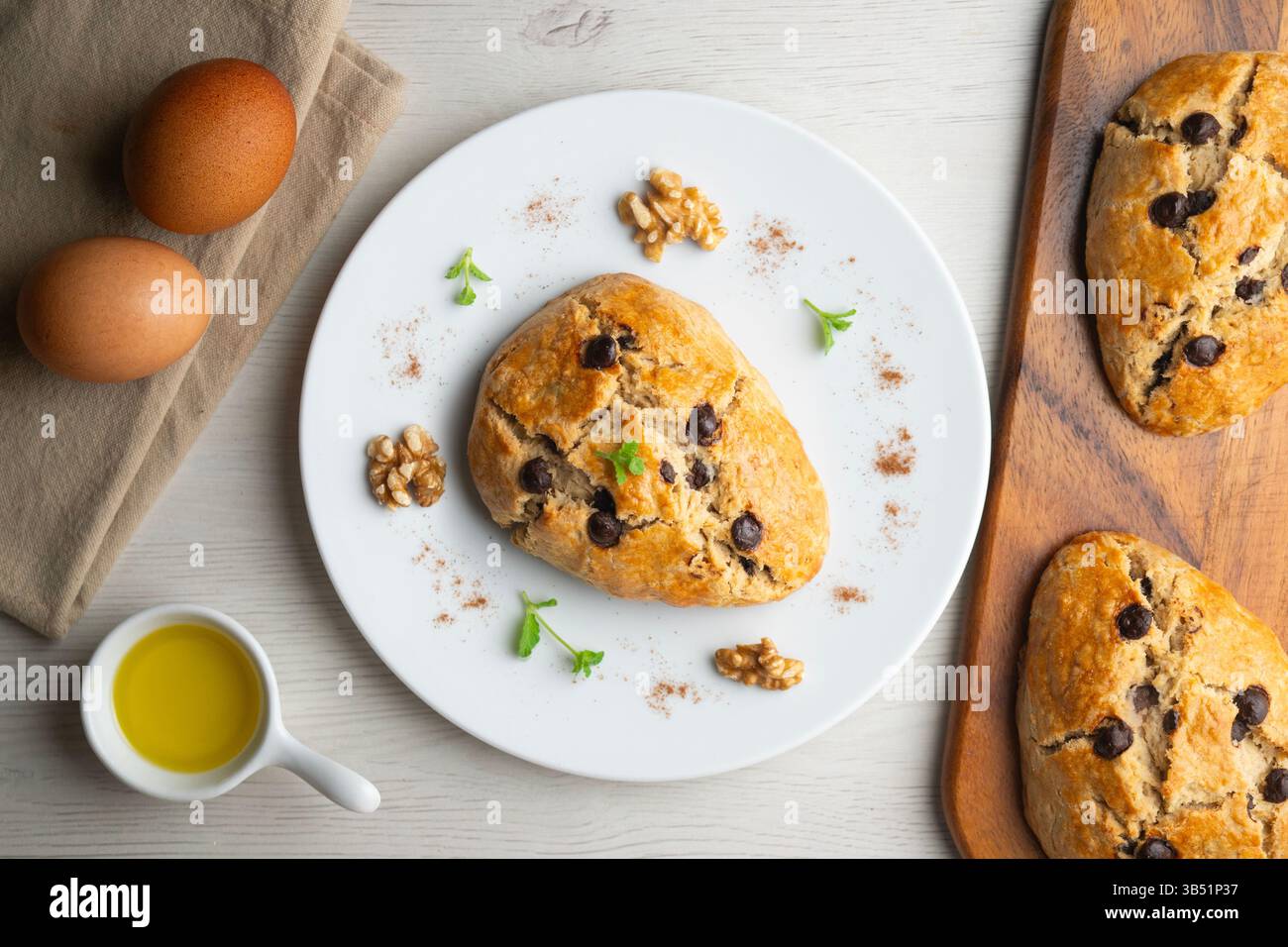 Triangular English scones with dark chocolate chips Stock Photo - Alamy
