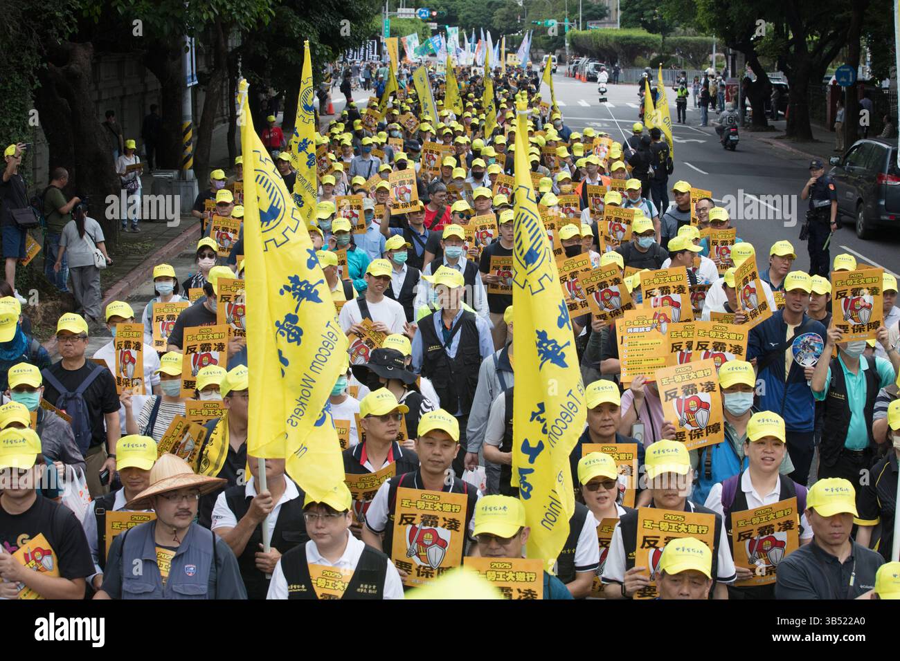 Participants hold placards and chant slogans during a rally in Taipei ...