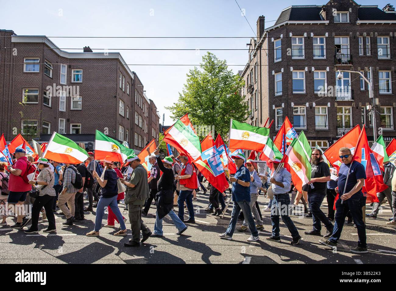 AMSTERDAM - Participants in the annual May 1 Labor Day march carry ...