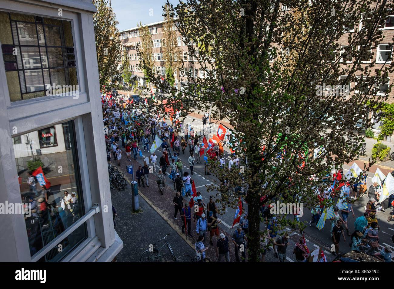 AMSTERDAM - Participants in the annual May 1 Labor Day march carry ...