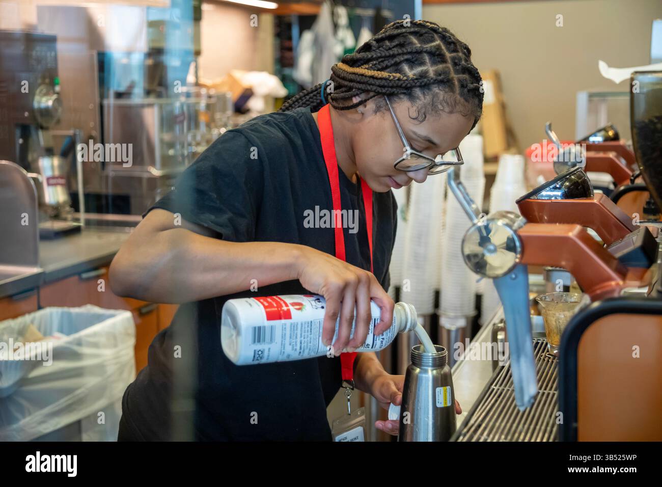 Detroit, Michigan - A young worker at a Starbucks coffee shop at ...