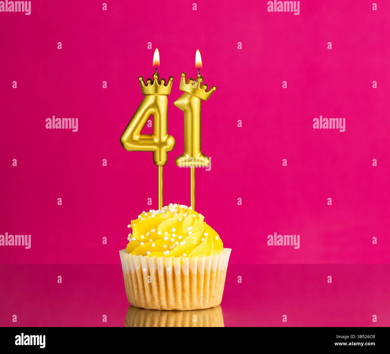 Yellow birthday cupcake with a number 41 candle - Birthday card on a ...