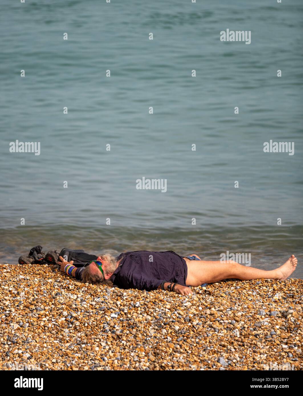 People enjoy the sunshine on Eastbourne beach as temperatures soar. The ...